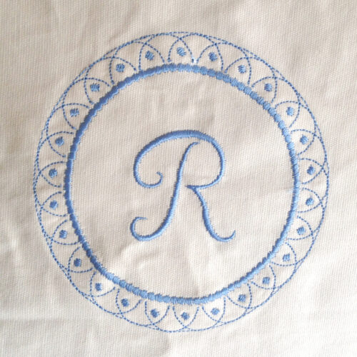 Single initial monogram embroidery design surrounded with decorative ...