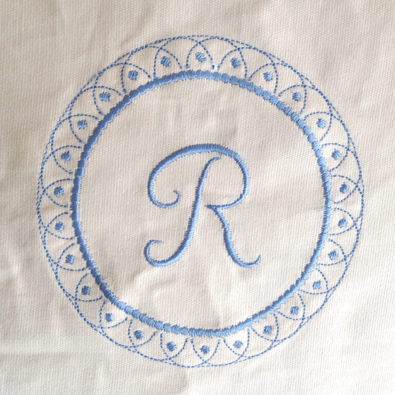 Single initial monogram embroidery design surrounded with decorative ...