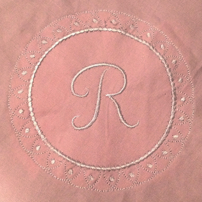 Single initial monogram embroidery design surrounded with decorative ...