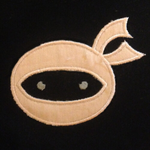 Simple and cute mysterious little ninja face machine applique design ...