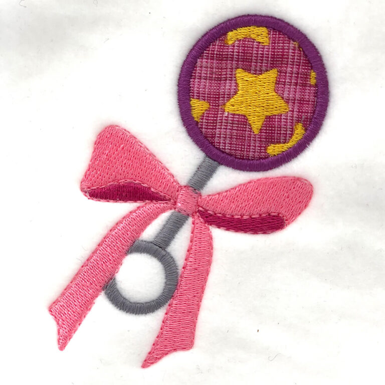 Baby rattle with bow appliqué design - Machine Embroidery Geek